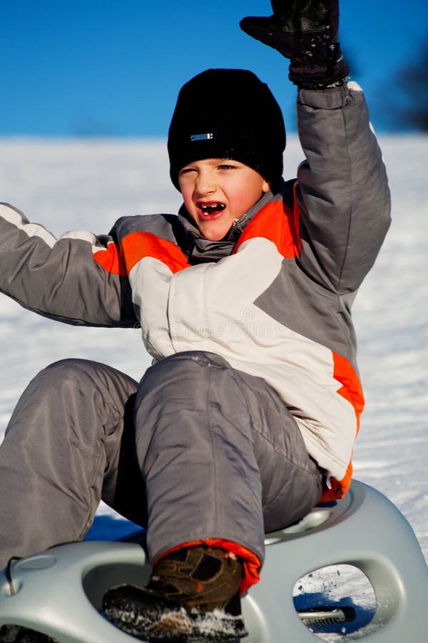 Sledding boy stock image. Image of cold, action, activity - 7682627