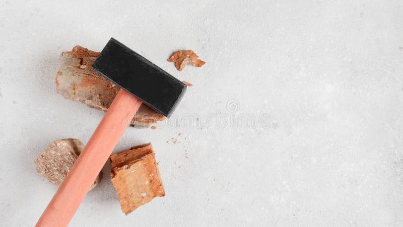 Sledgehammer Construction Tool on Red Bricks on Concrete Background ...
