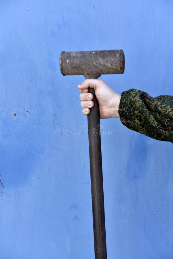 A Sledgehammer in the Hands of a Man. a Large Hammer in His Hands Stock ...