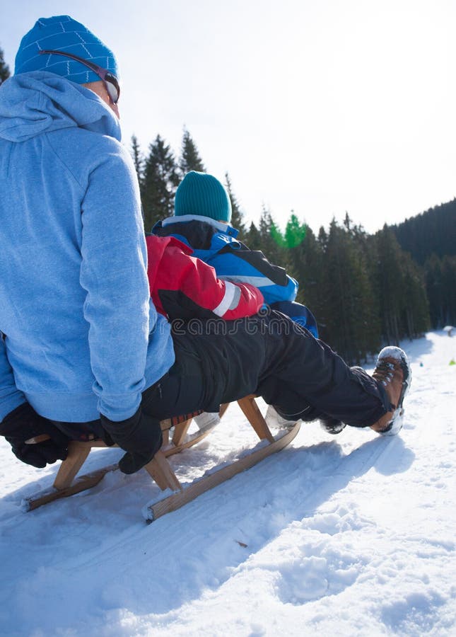 Sledging on the snow stock image. Image of leisure, mother - 137104963