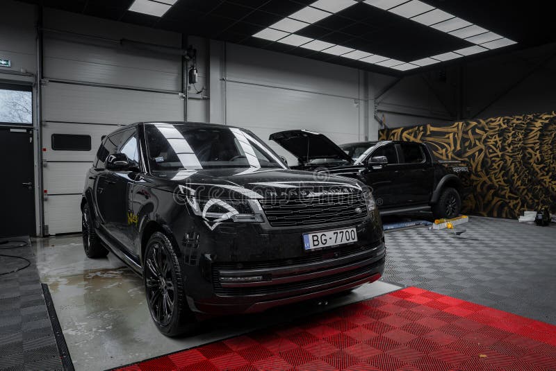 Black Range Rover Parked in Modern Garage with Checkered Floor Stock ...