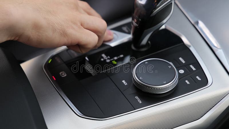 A Modern Car Interior Featuring an Advanced Gear Shift and Display Dial ...