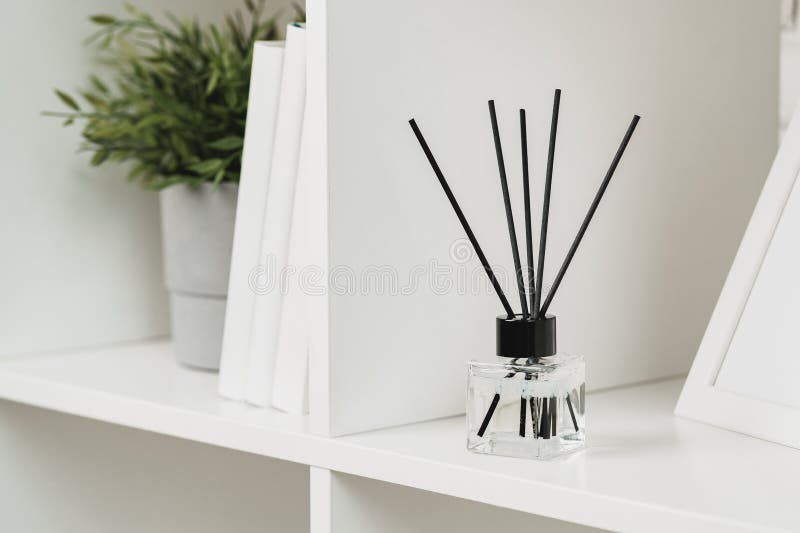 Elegant Reed Diffuser on White Shelf in a Modern Minimalist Interior ...