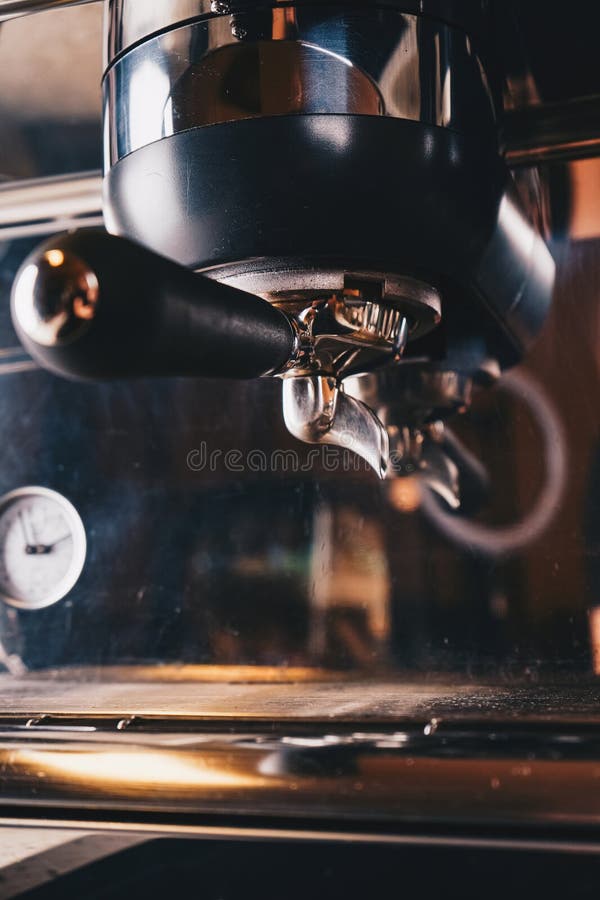 The Sleek Coffee Machine Reflects the Soft Caf Lighting, Its Levers and ...