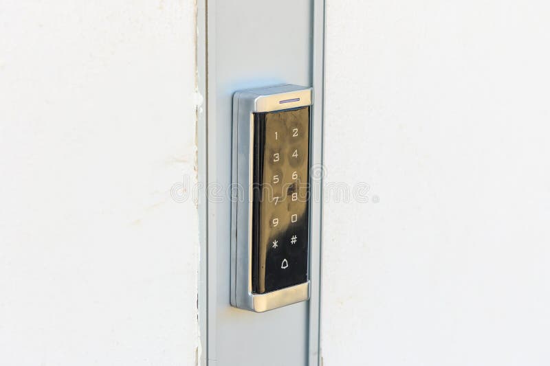 Modern Electronic Keypad Entry System Mounted on a Sleek Gray Door ...