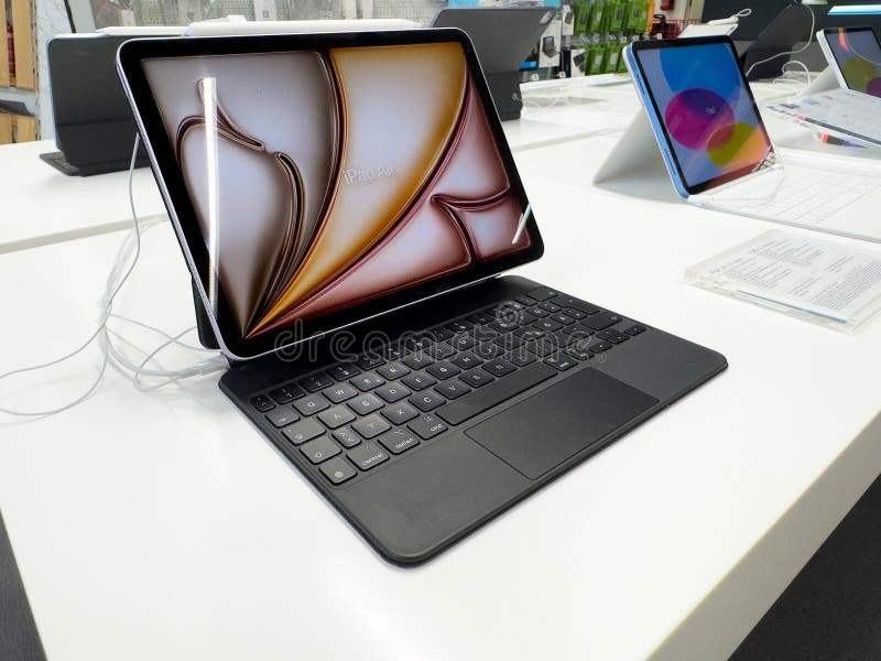 Sleek Ipad Air with Keyboard on Display in Tech Store Setting Editorial ...