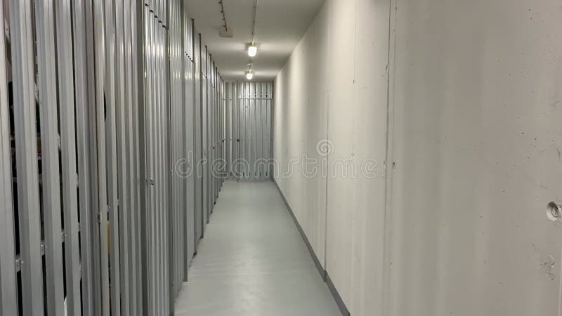 A Spacious and Long Corridor Featuring Multiple Storage Units in a ...