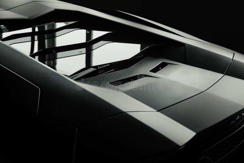Sleek, Modern Sports Car Engine Cover with a Reflective Glass Surface ...