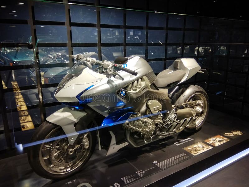 A Silver Motorcycle on Display Behind Glass in a Display Case Editorial ...