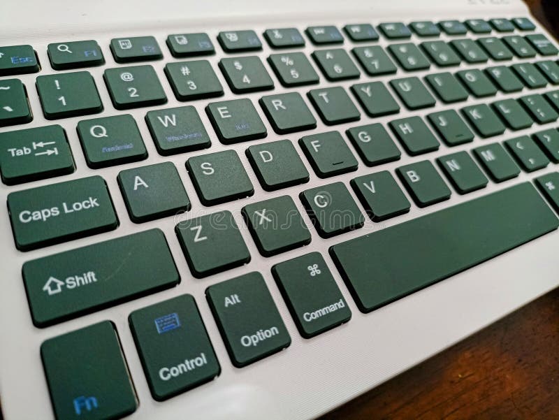 Sleek Simplicity: Wireless Keyboard in White with Dark Green Keys Stock ...