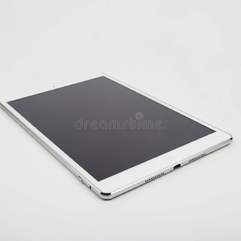 A Sleek Tablet Device with a Black Screen and a White Border Rests on a ...