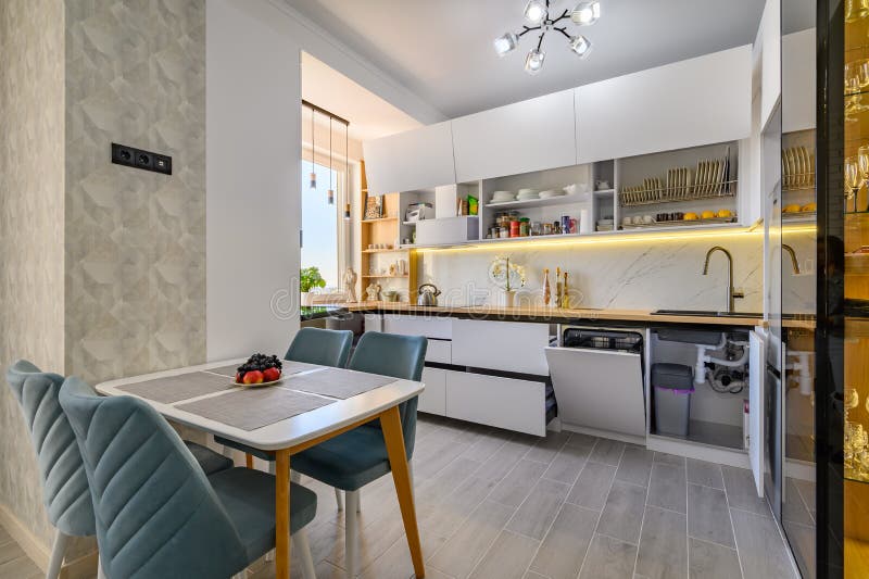 A Sleek White Kitchen with Drawers Pulled Out To Their Full Length ...