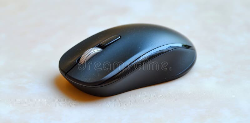 A Sleekly Designed Wireless Computer Mouse is Positioned on a Smooth ...