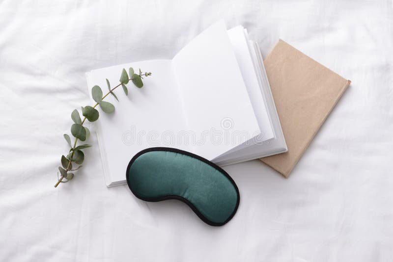 Sleep Mask and Notebooks on Bed Stock Photo - Image of care, notebooks ...