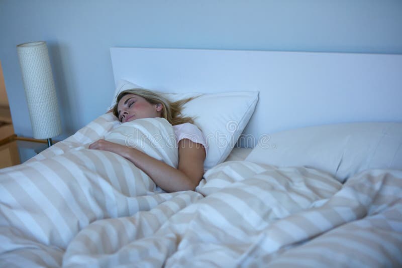 Sleep Solves Everything. a Beautiful Woman Sleeping Peacefully in Her ...