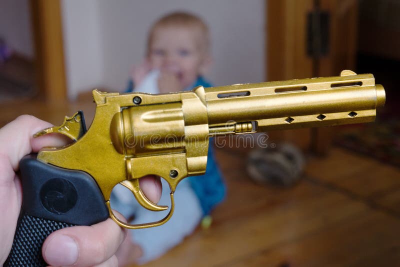 Sleeping Baby with a Gun in His Hands Stock Image - Image of grin ...