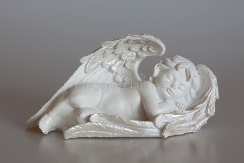 Sleeping Cherub Angel Statue with Wings for a Bed Stock Photo - Image ...