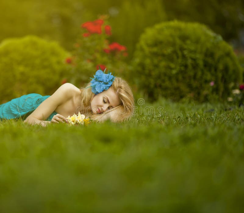 Sleeping girl on the grass stock photo. Image of smile - 54470038