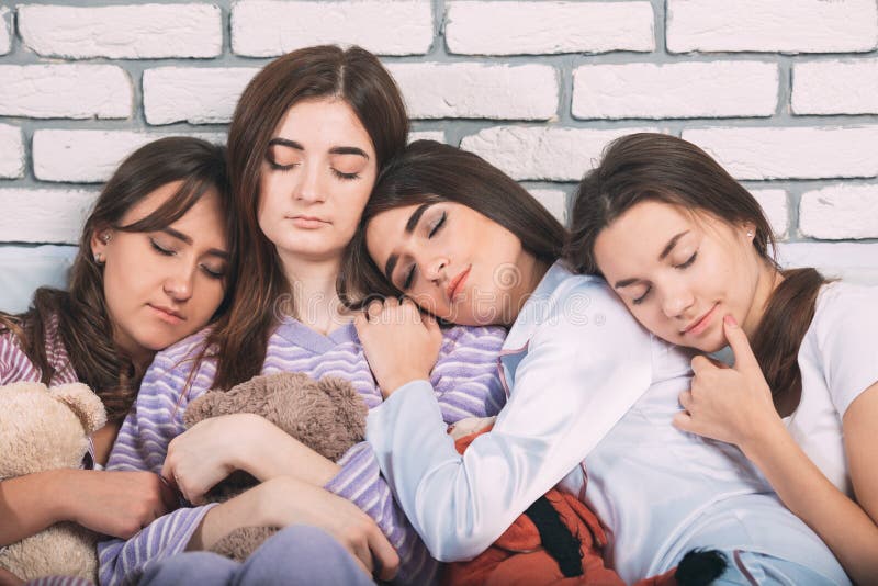 Sleeping Group of Young People on the Bed. Stock Image - Image of girl ...