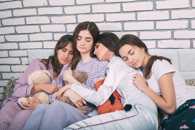 Sleeping Group of Young People on the Bed. Stock Photo - Image of ...