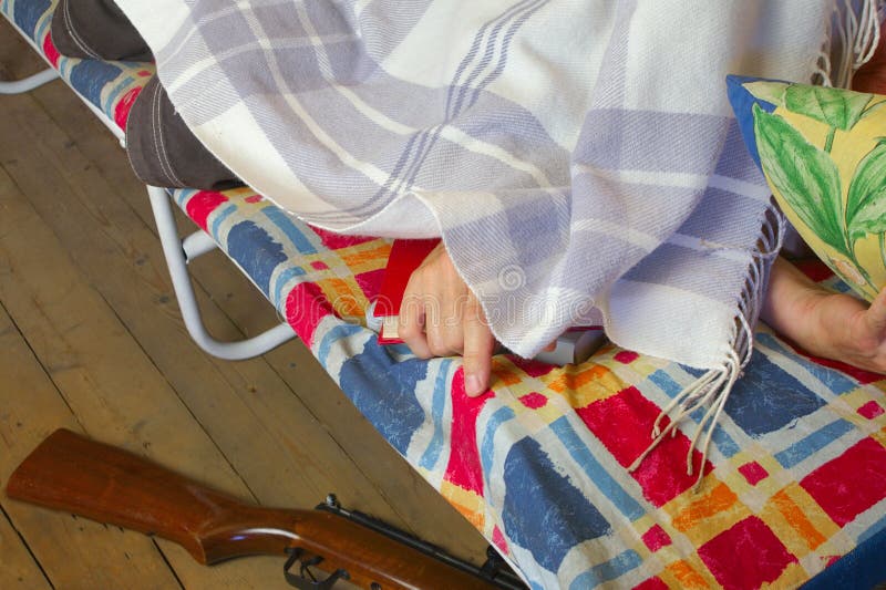 Sleeping with a Gun stock image. Image of bedroom, blanket - 120366663