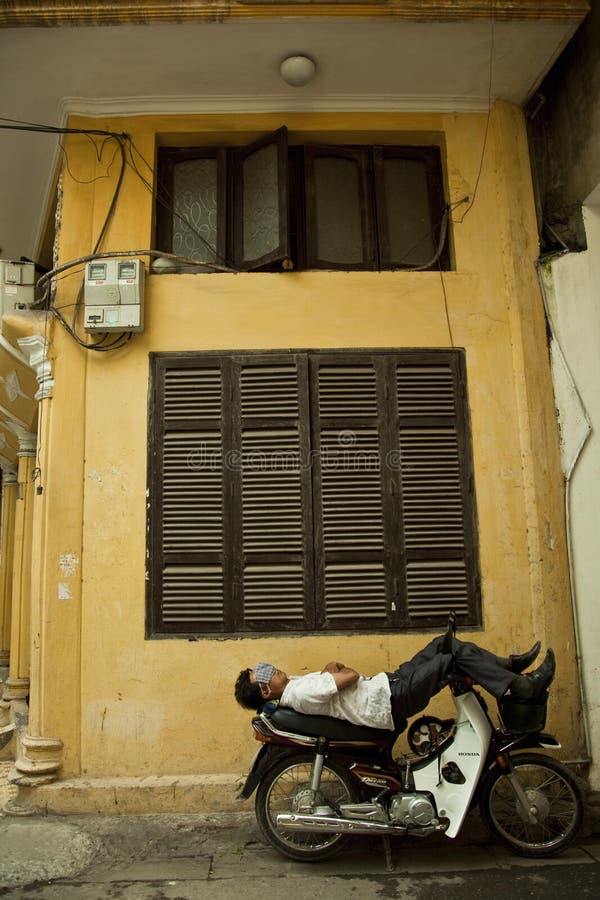 Sleeping man on a bike editorial image. Image of relaxation - 22272210