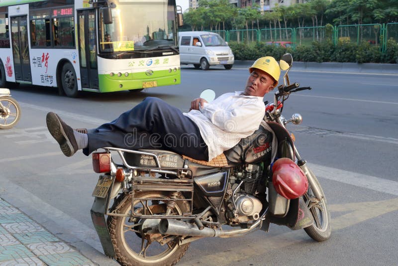 Sleeping on the motorcycle editorial image. Image of culture - 35046505