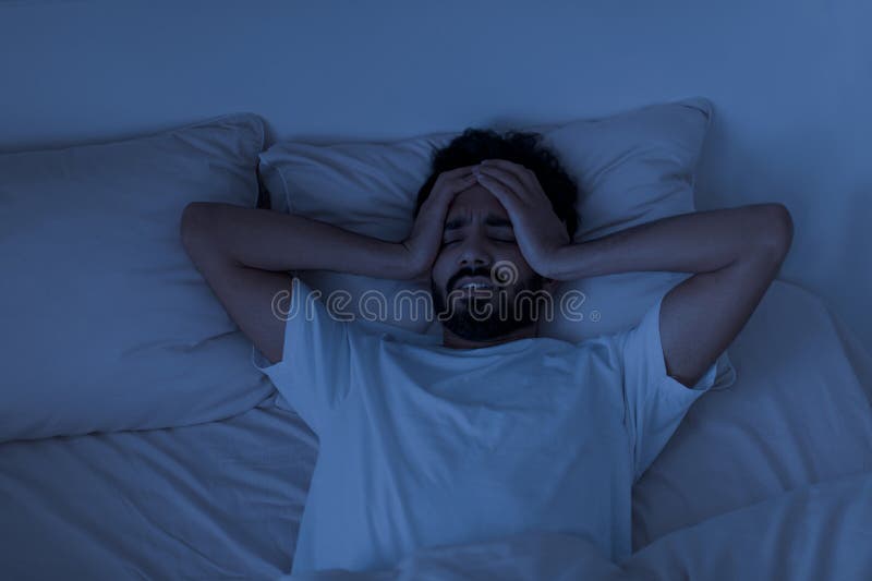 Healthy Sleeping. Portrait of Young Indian Man Lying in Bed in Night ...