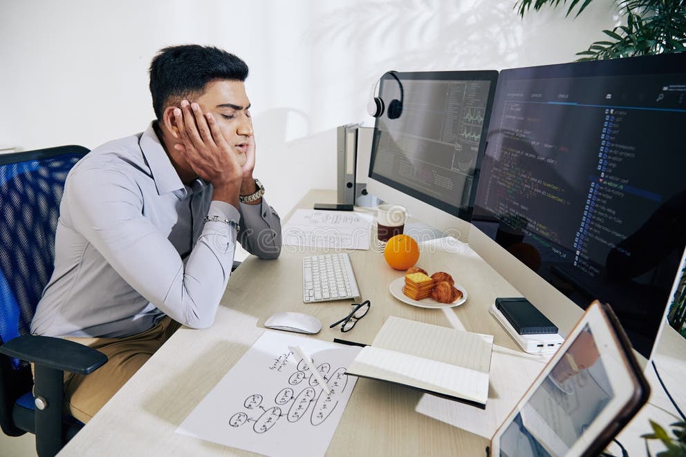 Almost sleeping programmer stock image. Image of pensive - 200015797