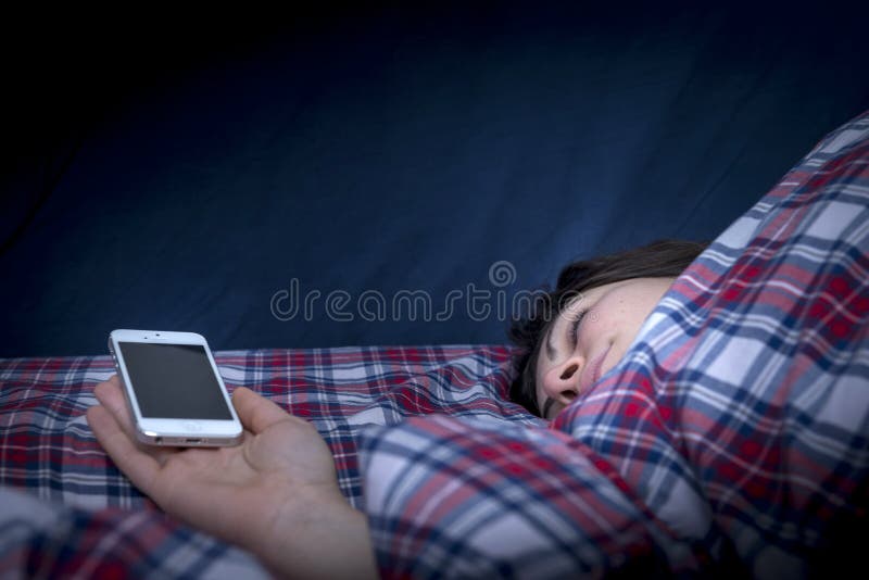 Sleeping with smartphone stock image. Image of hand, mobile - 66448015