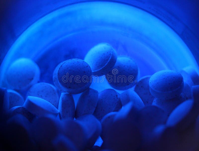 Sleeping Tablets on a Blue Background Stock Photo - Image of sedatives ...