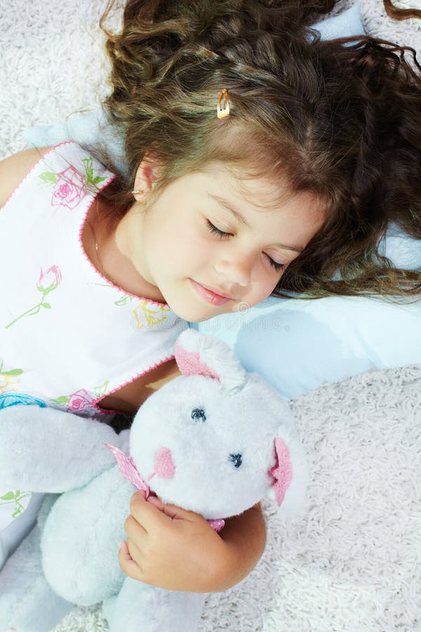Sleeping with toy stock photo. Image of angle, people - 29515520