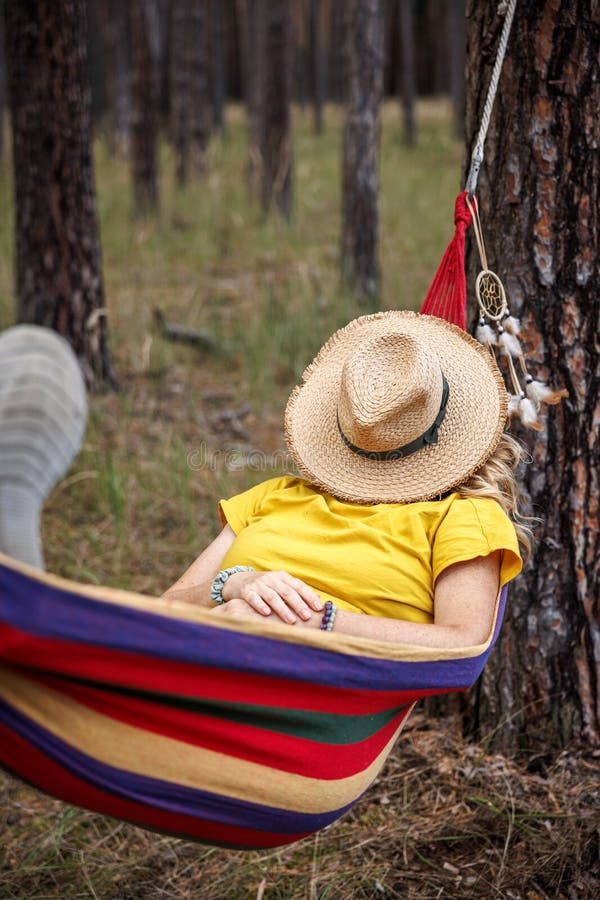 Sleeping Woman with Covered Face by Hat Resting in Hammock in Forest ...