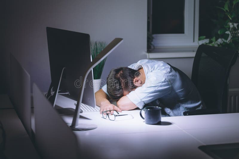 Sleeping Young Man Working on Computer at Night in Dark Office Stock ...