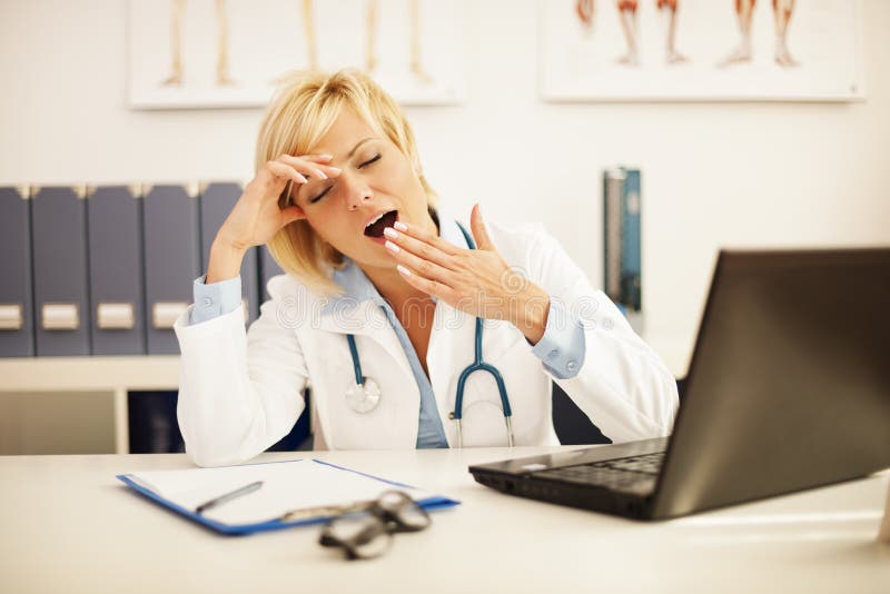 Sleepy doctor stock photo. Image of hospital, desk, occupation - 33268176