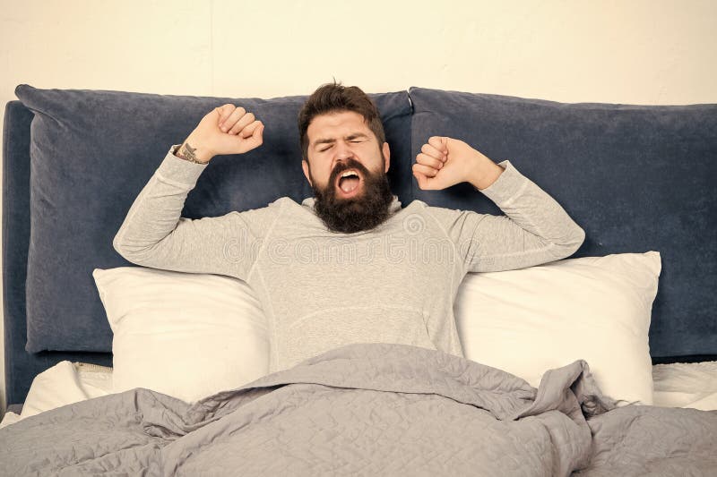 Sleepy Man Yawning and Stretching in Bed Waking Up after Sleep, Morning ... Sleepy Man Yawning and Stretching in Bed Waking Up after Sleep, Morning ...