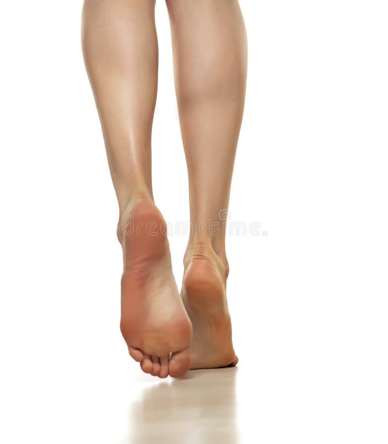 Slender Beautiful Female Bare Feet Rear View on a White Background ...