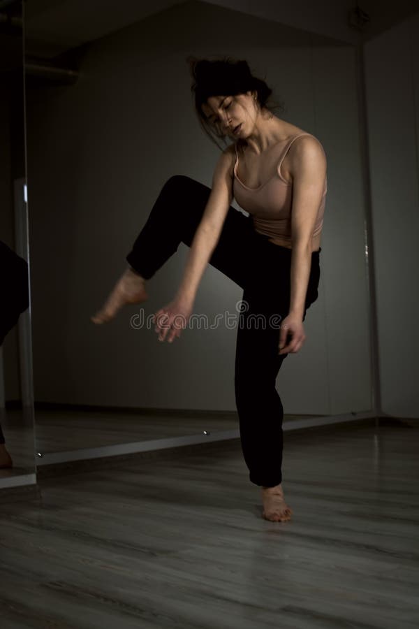 Slender Flexible Dance Performer during a Dance Practice in Modern ...