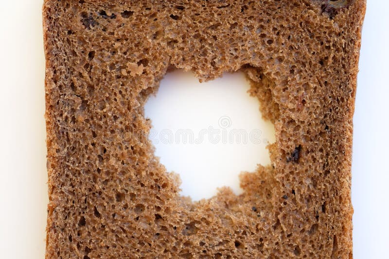 A Slice of Black Bread with a Hole in the Middle. Stock Image - Image ...