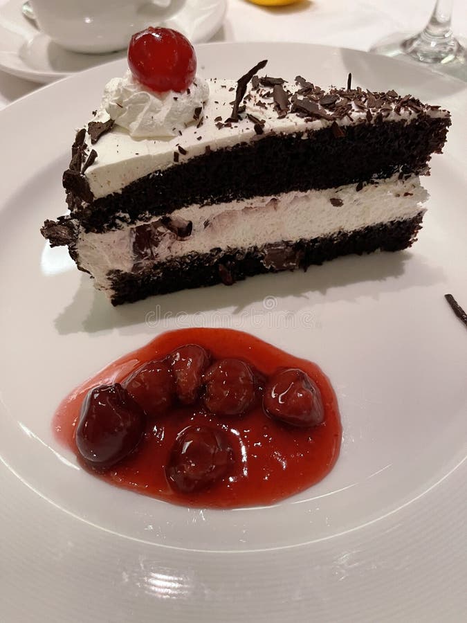 Slice of black forest cake stock photo. Image of icing - 375876248