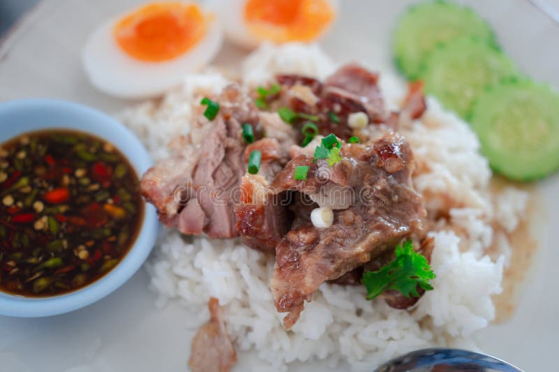 Braised Pork Placed on Hot Steamed Rice Served with Boiled Egg and ...