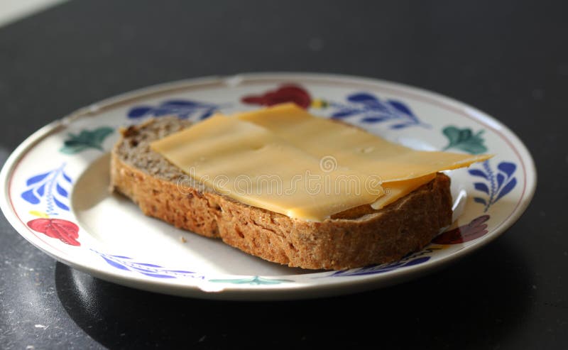 Slice of Bread with Cheese on a Plate in Kitchen Stock Image - Image of ...