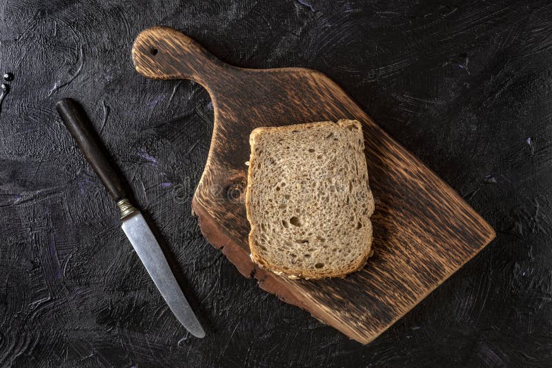 Slice of Bread on a Chopping Board Stock Photo - Image of knife, food ...
