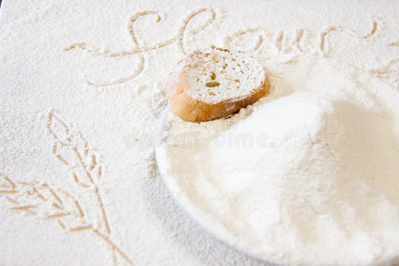 Slice of Bread Covered with Flour. Word Flour Written from Hand Stock ...