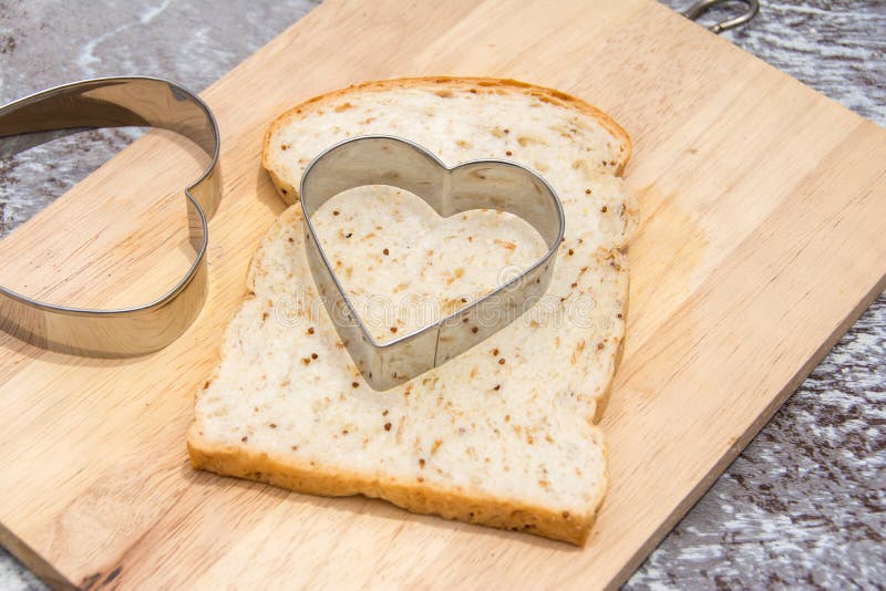 Slice of Bread with Cut Out Heart Shape Stock Image - Image of hearty ...