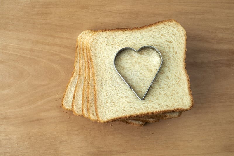 Slice of Bread with Cut Out Heart Shape Stock Photo - Image of diet ...
