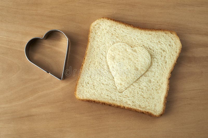Slice of Bread with Cut Out Heart Shape Stock Photo - Image of diet ...