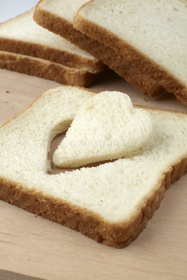 Slice of Bread with Cut Out Heart Shape Stock Photo - Image of diet ...