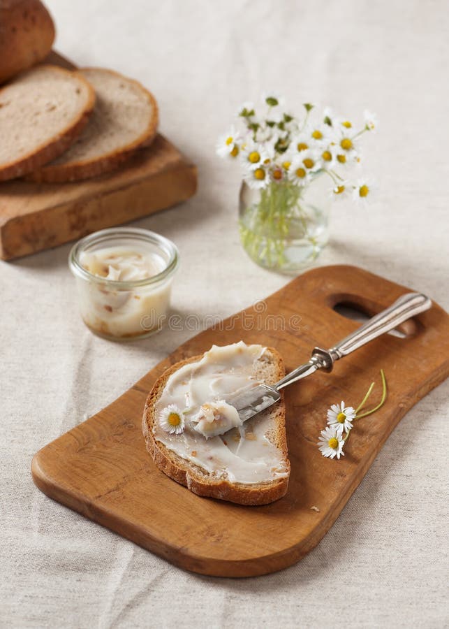 Slice of Bread with Homemade Goose Fat Spread and Edible Daisy Flowers ...