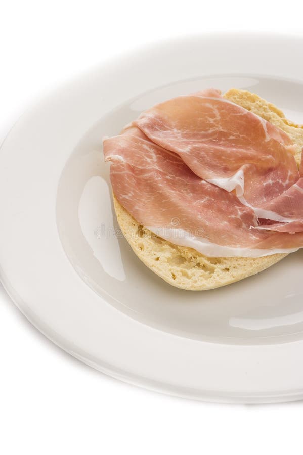 Slice Bread with Parma Ham on White Plate Closeup Stock Image - Image ...